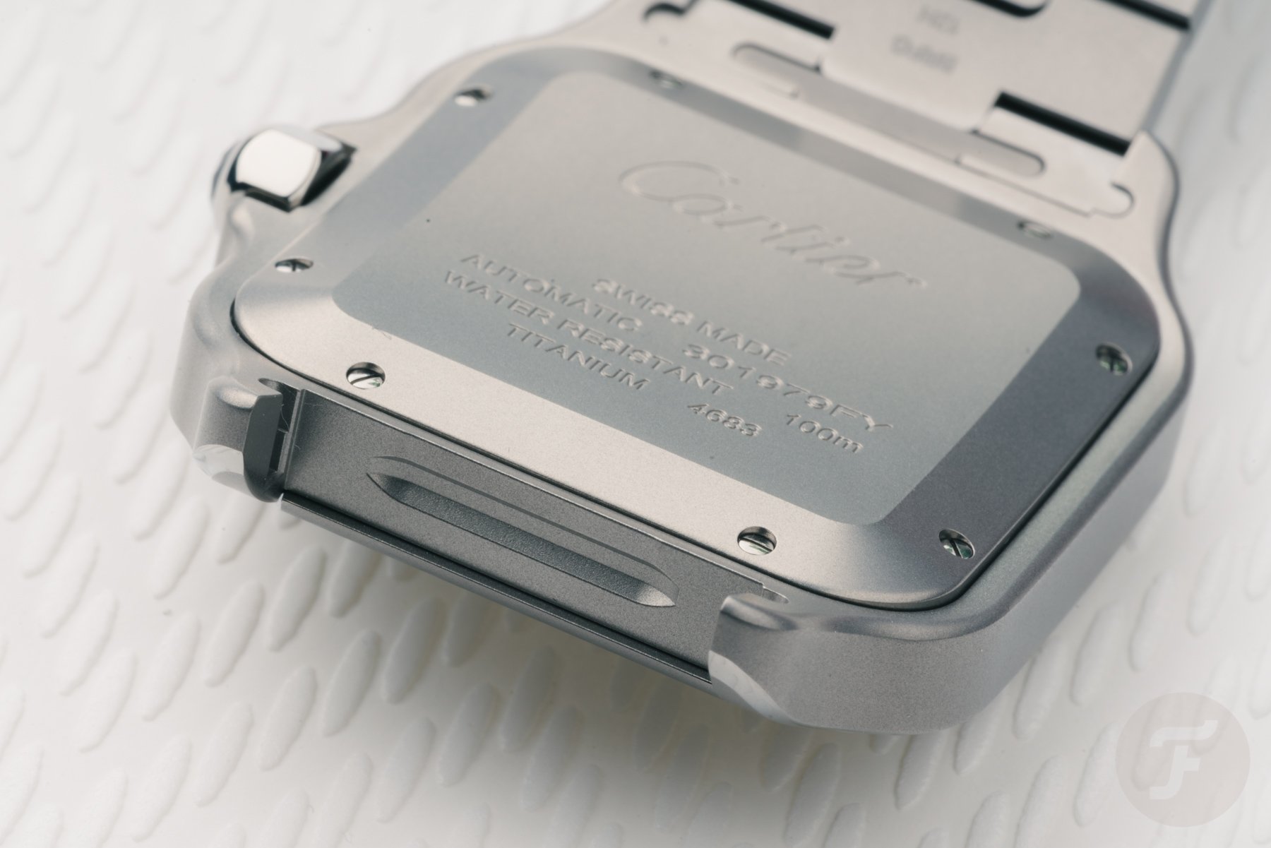 【F】New: A Titanium Cartier Santos And A Black-Dial Steel Model